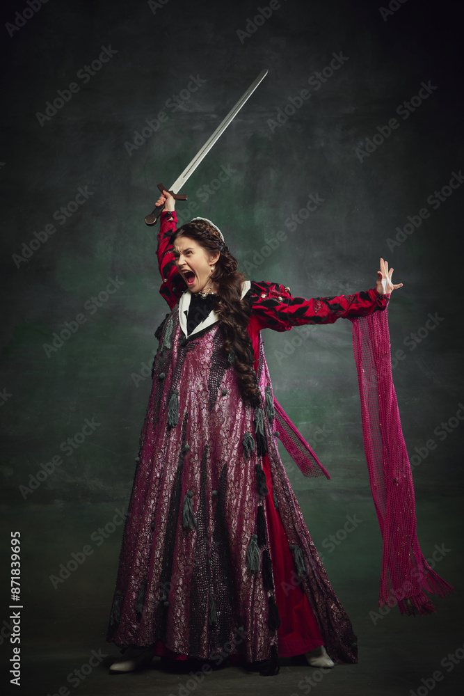 Woman in Renaissance-style gown, holding sword and shouting, exuding ...