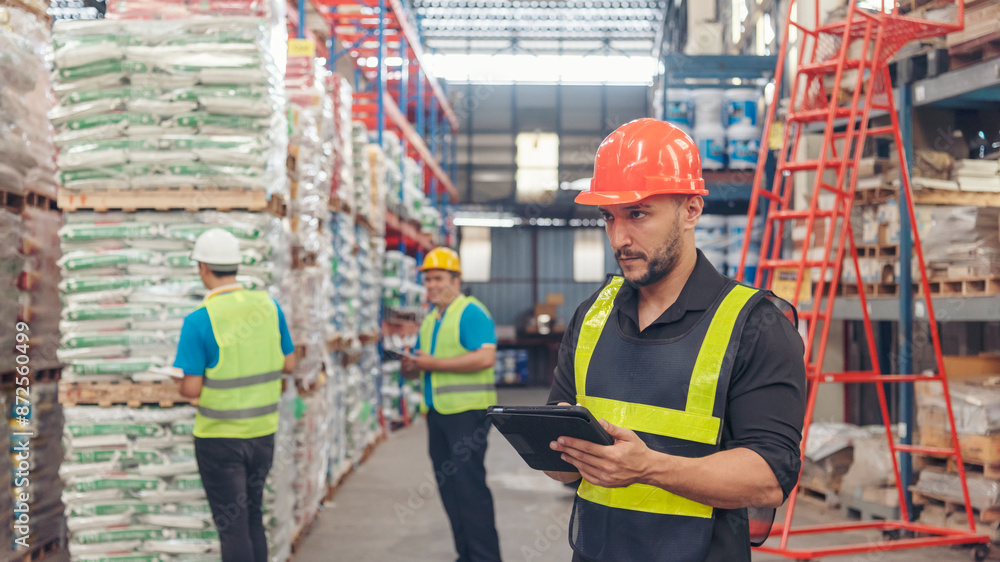 Warehouse management logistics team counting checking products on ...