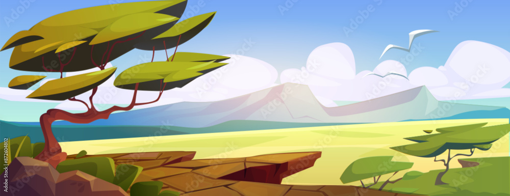 African savannah landscape with green grassland, trees and bushes, rock ...