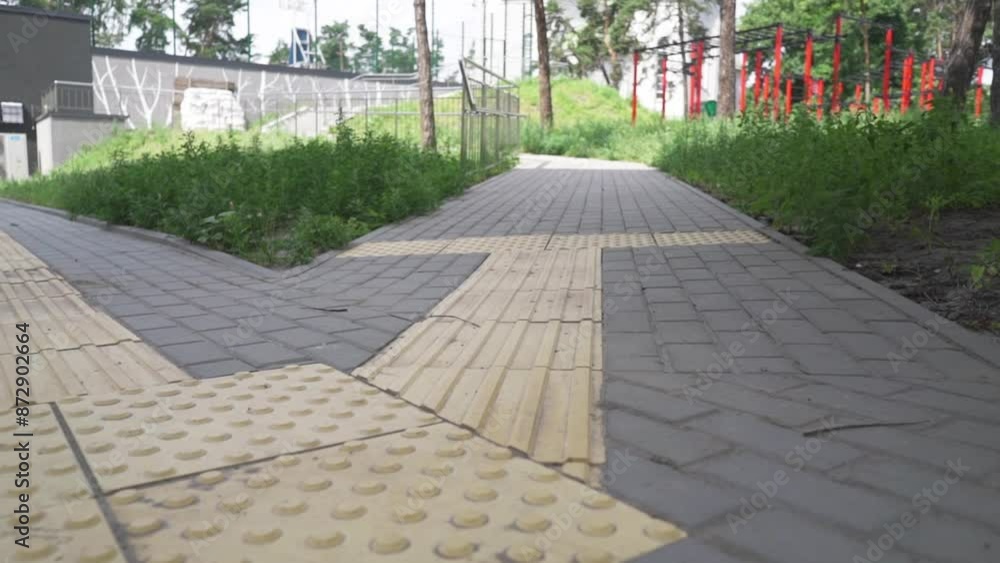 Metropolitan navigation: Elevated view of tactile pavement with braille ...