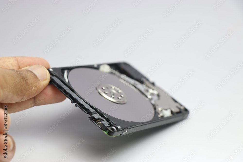 Computer hard disk drive with its top case removed to have a look at ...