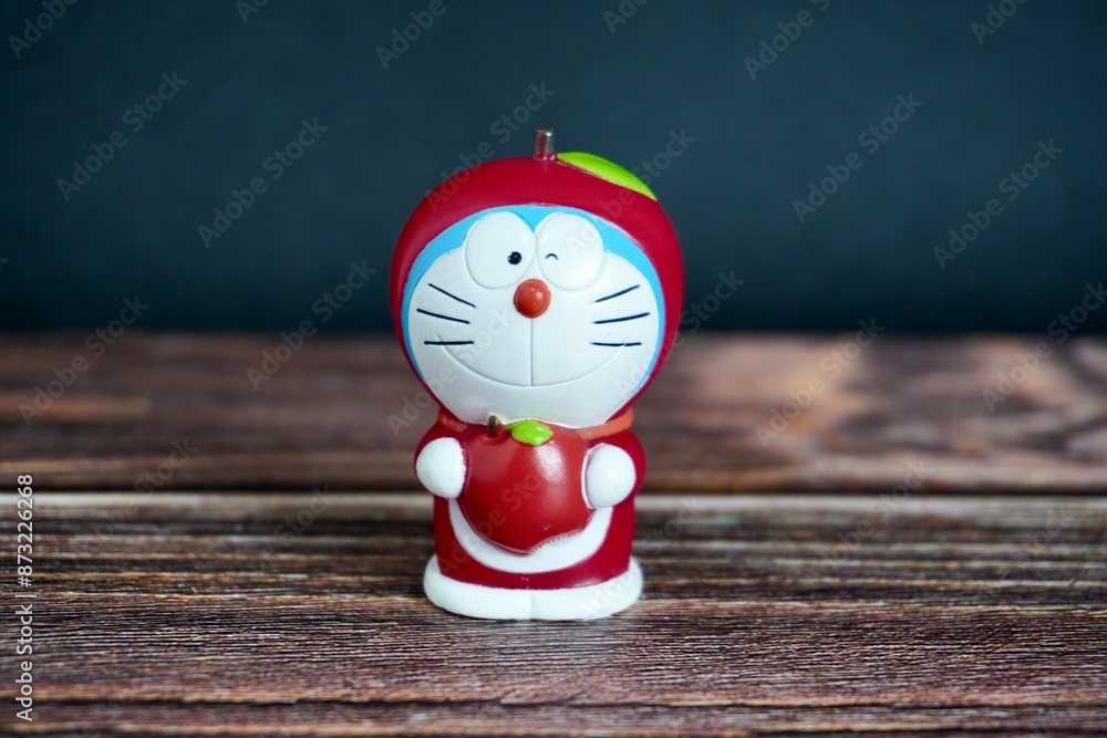 Jakarta, Indonesia - July 3rd, 2024 - Doraemon character with red apple ...