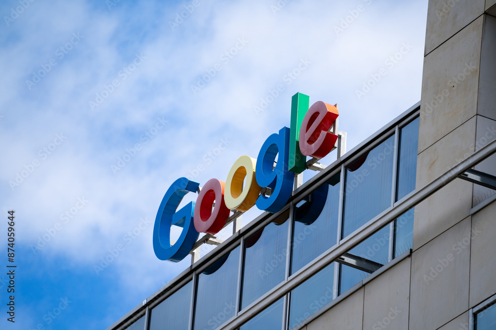 Google logo sign on the office building in Wrocław. American ...