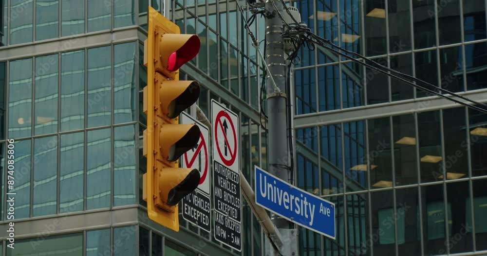 A green light on traffic control equipment at a downtown intersection ...