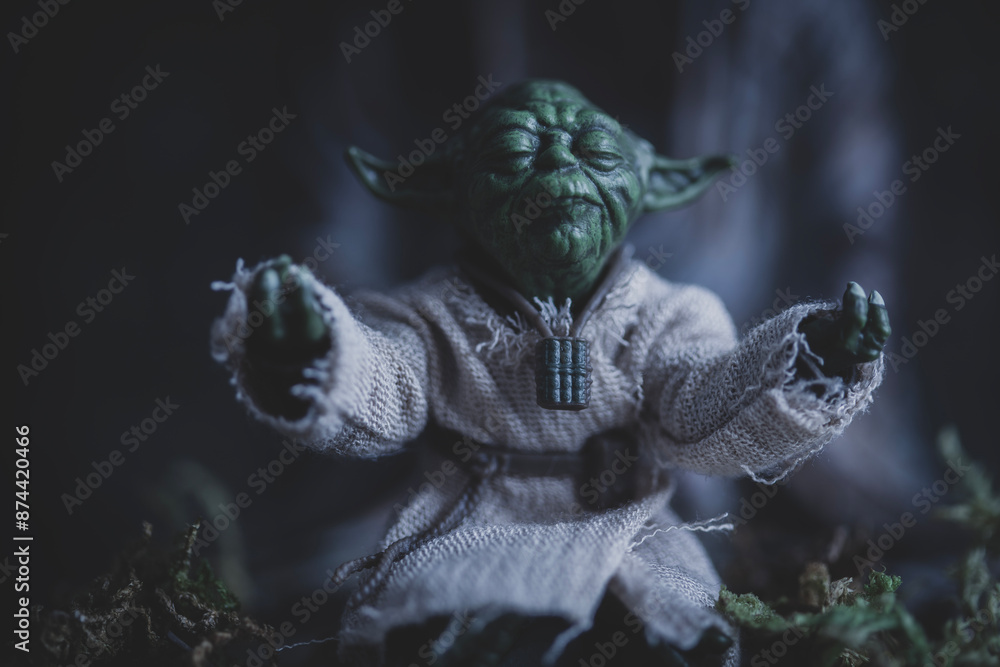 NEW YORK USA, JULY 7 2024: Jedi Master Yoda meditating with the Force ...