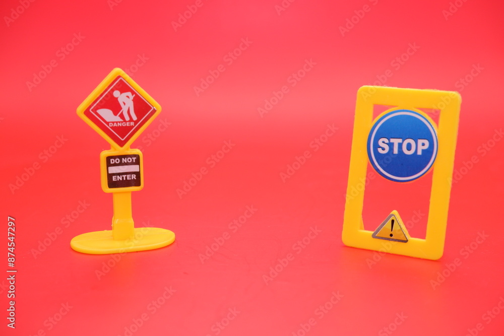 miniature stop signs and do not enter signs isolated on a red ...