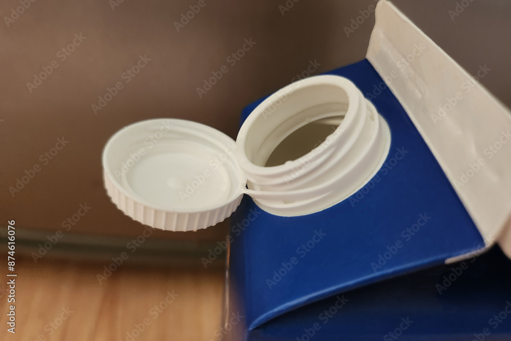 Milk Carton Cap Close-Up. A close-up view of a new cap attached to a ...