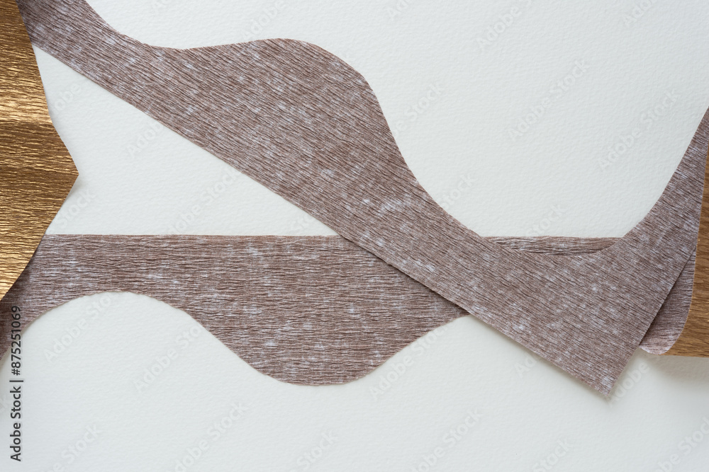 the reverse side of crepe paper shape with wavy and straight edges ...