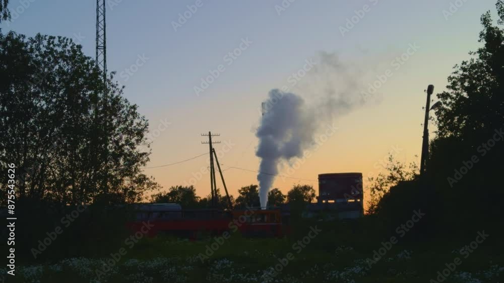 Smoke coming from diesel locomotive in golden twilight. Dark ...