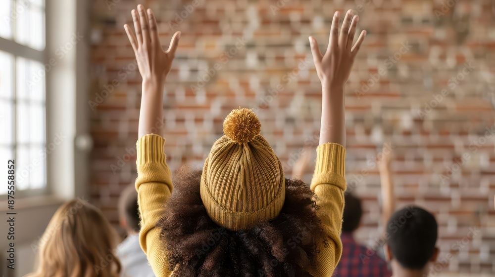Diverse group of students raising their hands eagerly in a sunlit ...