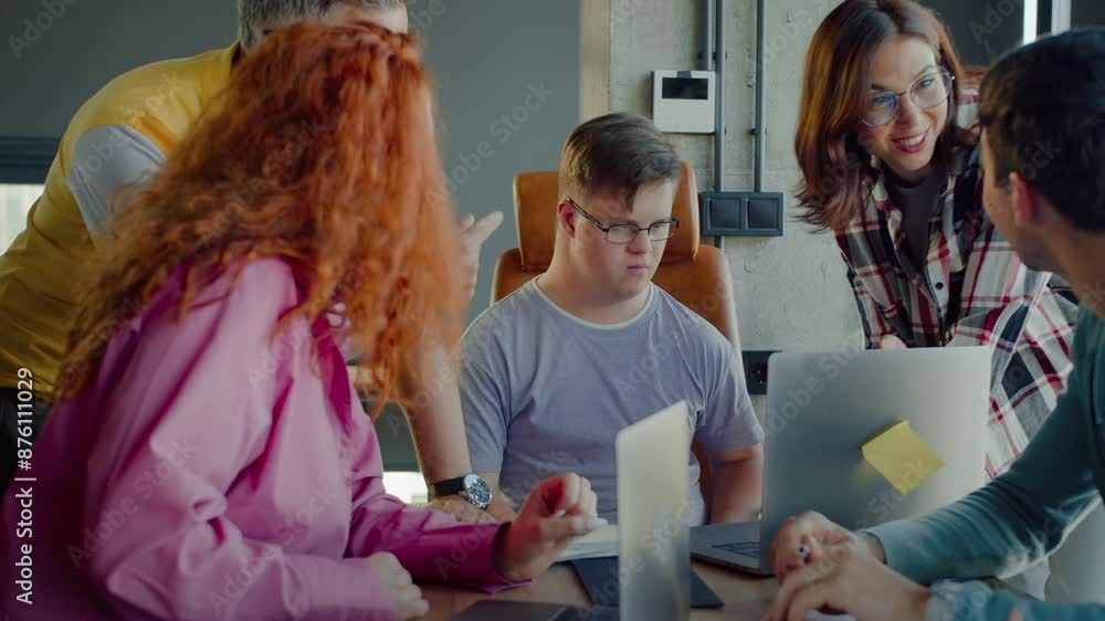 Man with intellectual disability sitting by table with pc Stock Video ...