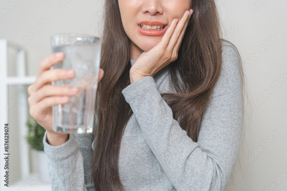 Suffering from toothache, hurt asian young woman touch cheek, face ...