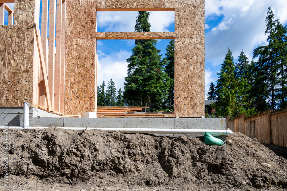 View from below of new home construction, cement foundation with pvc ...