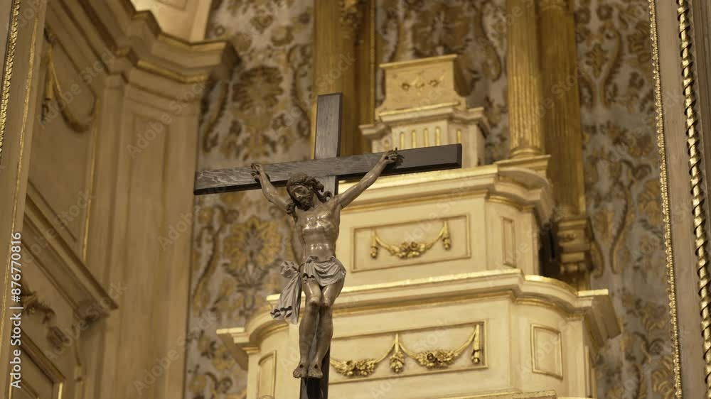 Crucifix statue of Jesus on the cross in an ornate church altar ...