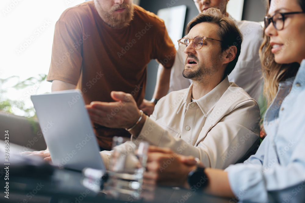 Business man showing his colleagues a slideshow presentation of his ...
