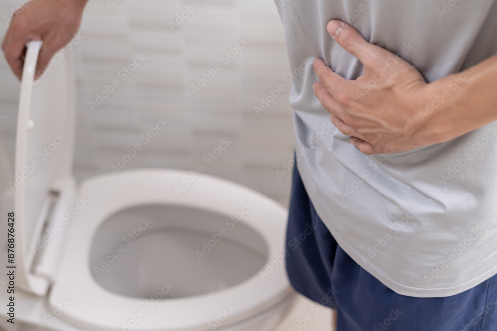 Constipation and diarrhea in bathroom. Hurt man touch belly stomach ...