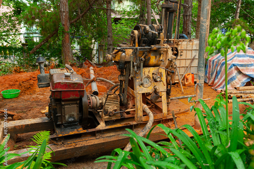 Ground water hole drilling machine working in a construction site for ...