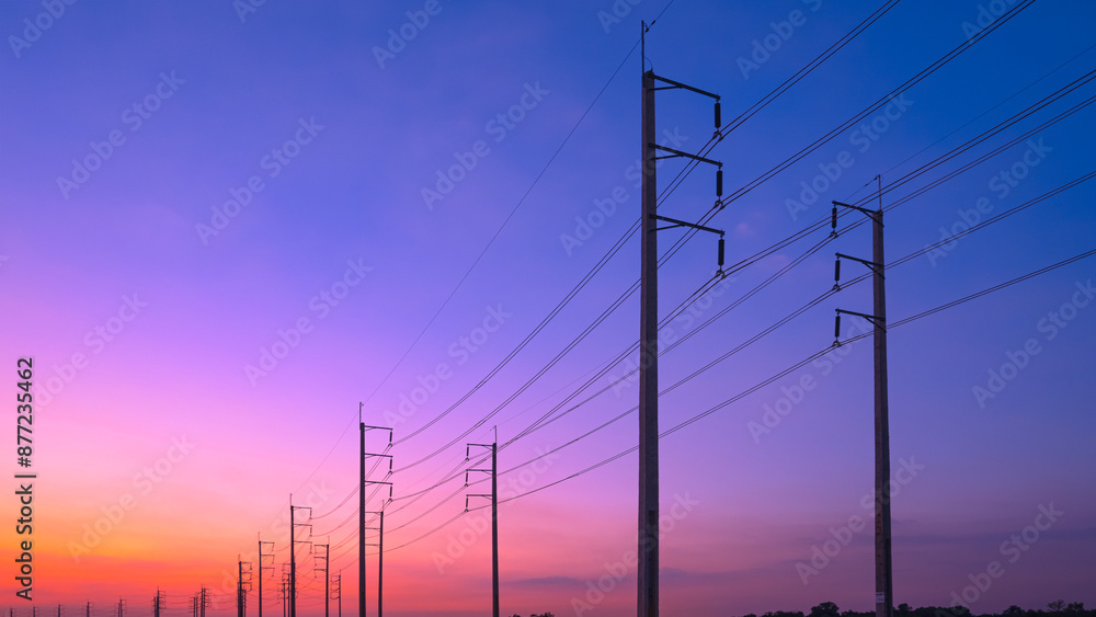 Silhouette 2 rows of electric poles with cable lines on curve country ...