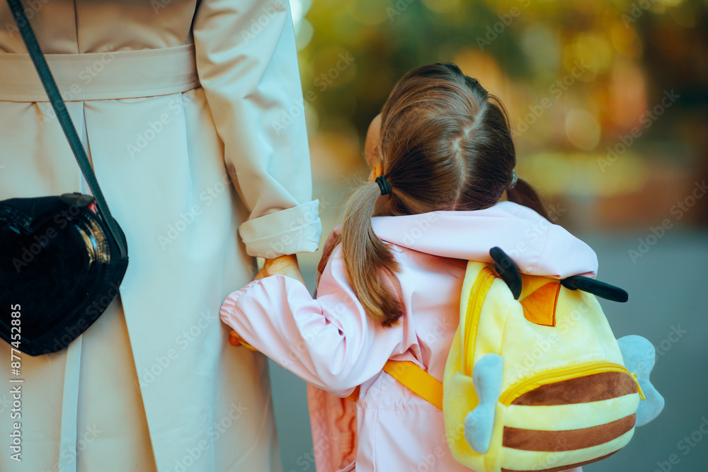 Mom Holding Her Daughter Guiding Her in the First Day of School. Little ...