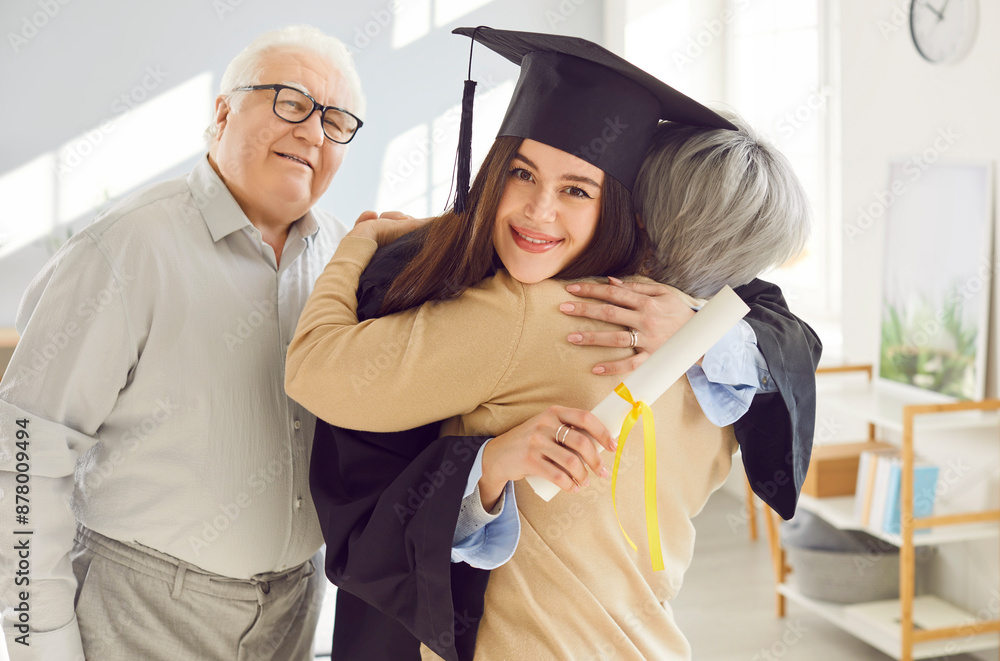 Portrait of a elderly parents congratulate daughter, a university ...