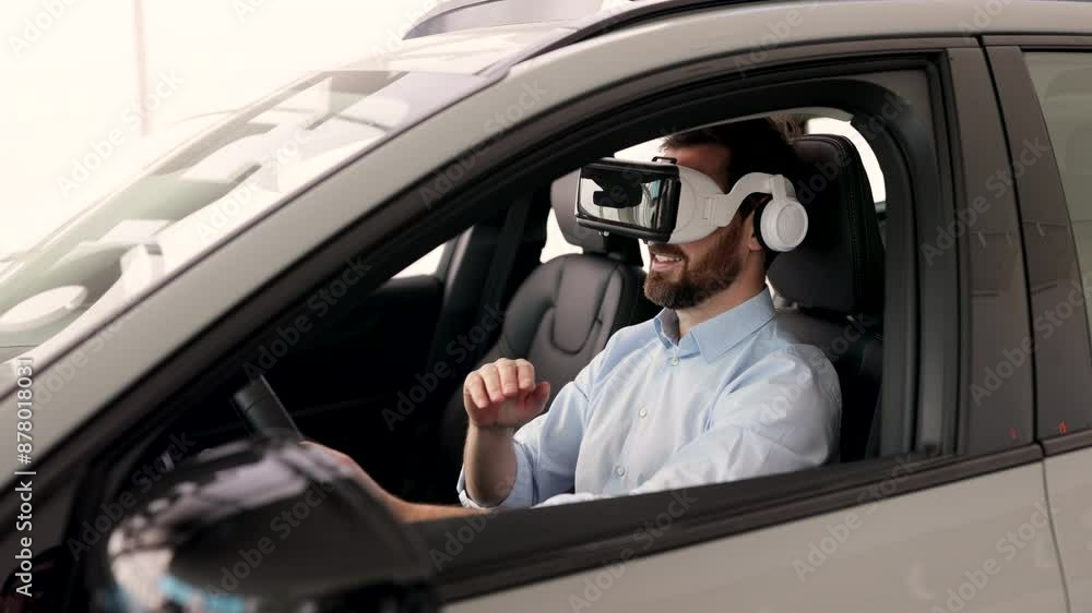 Businessman uses virtual reality headset while sitting inside vehicle ...