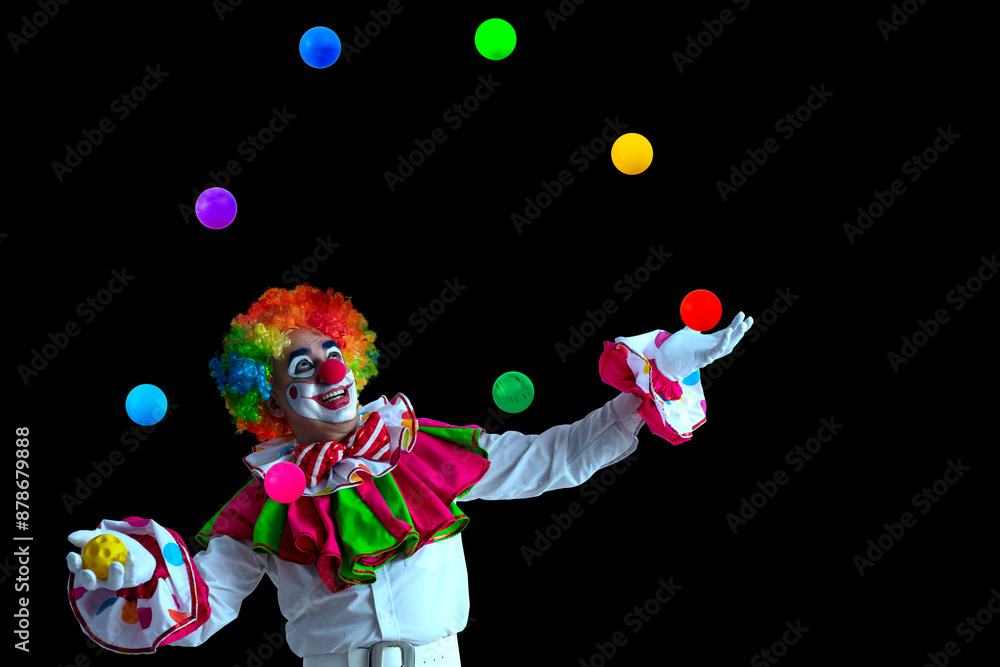 Funny juggler clown juggling balls in the circus, man entertainer as ...