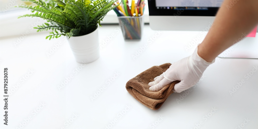 Focus on gloved male hand holding cloth and swiping all dirt and dust ...