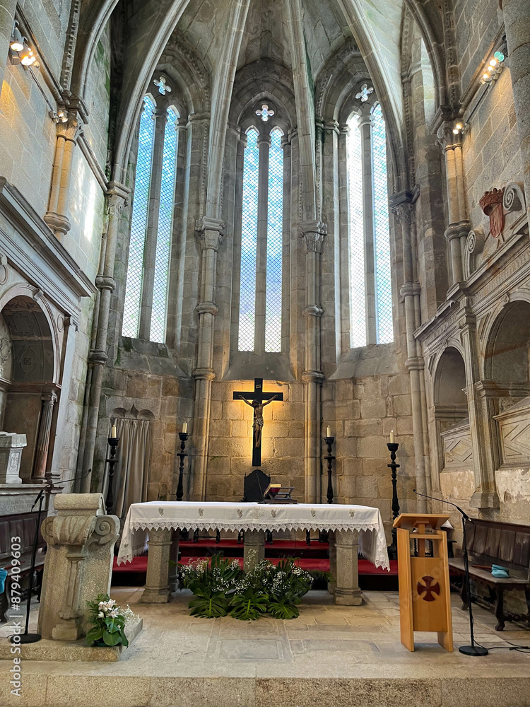Stone altar and presbytery and stained glass windows in medieval Gothic ...