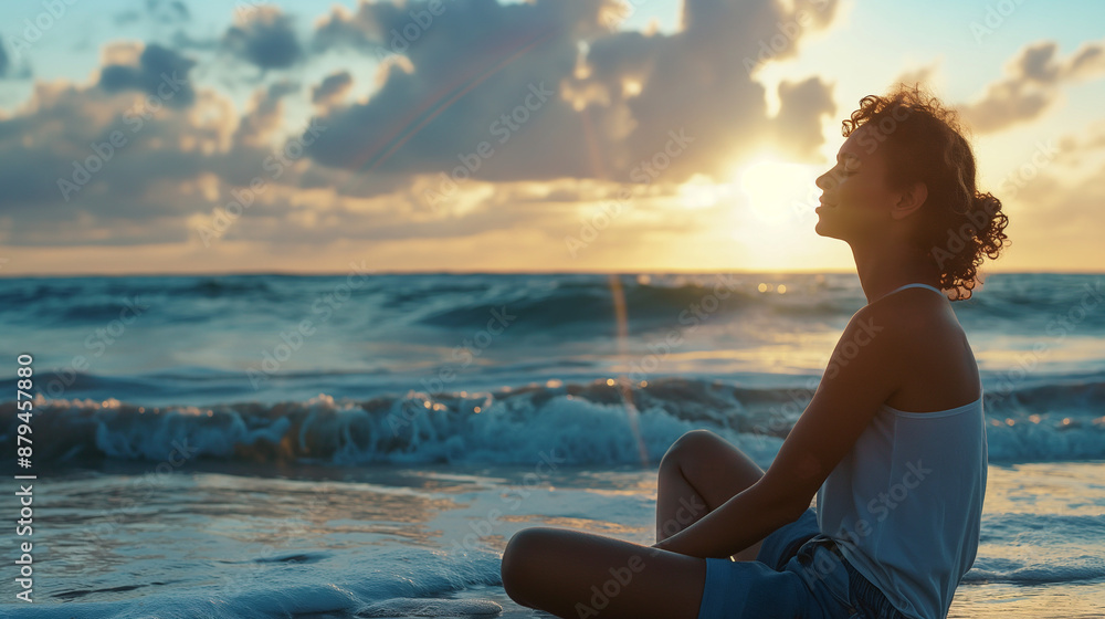Person sitting on a beach with eyes closed and a serene expression ...