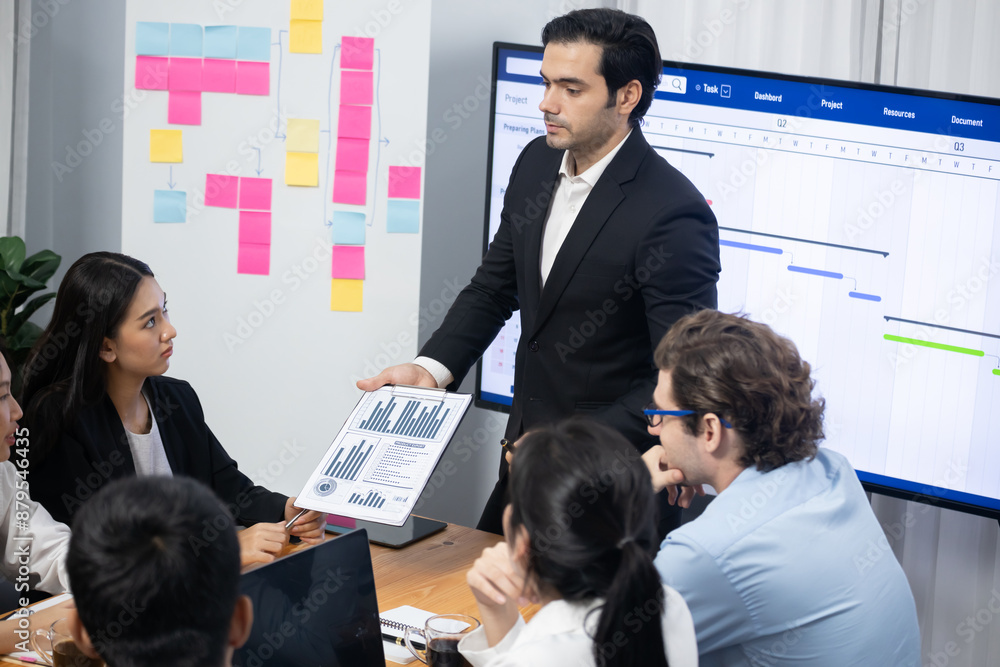 Project manager planning schedules for business task at meeting room ...