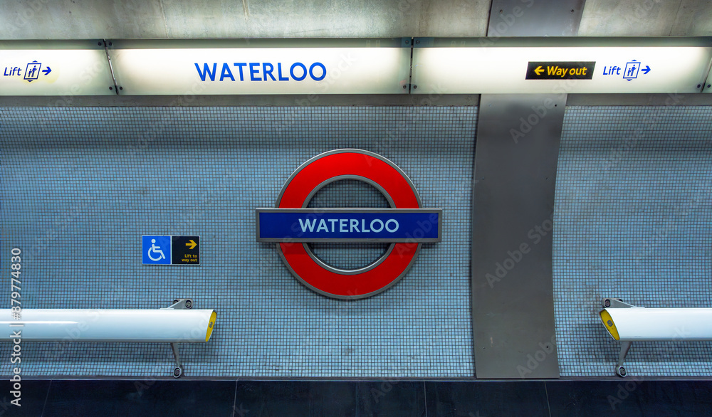 London Underground sign for Waterloo station with backlit signs ...