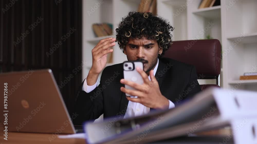Confused young indian businessman get notification and feeling upset ...