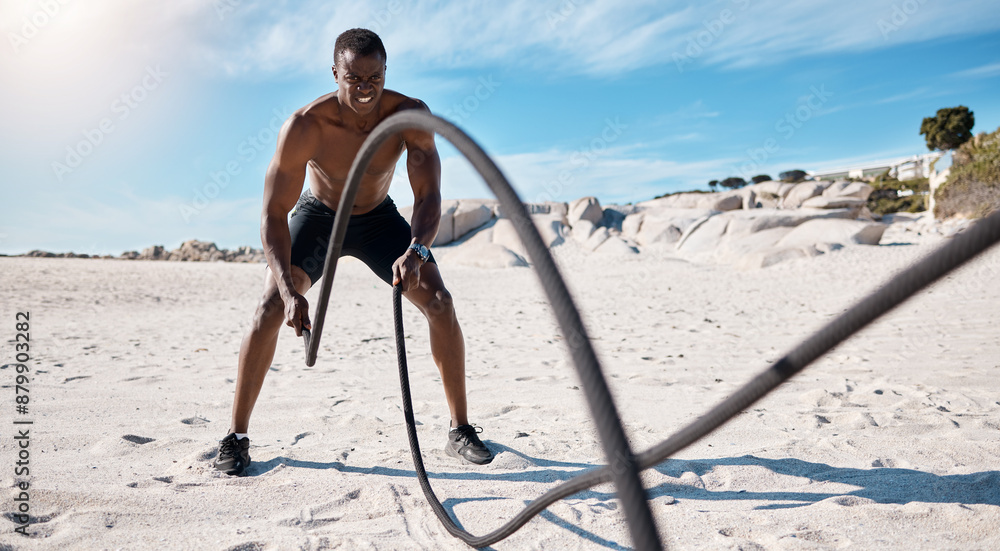 Athlete, exercise and battle ropes on beach for fitness, workout and ...