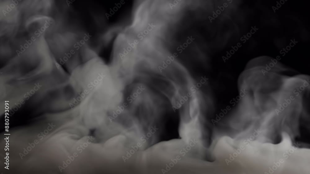 Seamlessly looping video of thick heavy smoke blowing and swirling ...