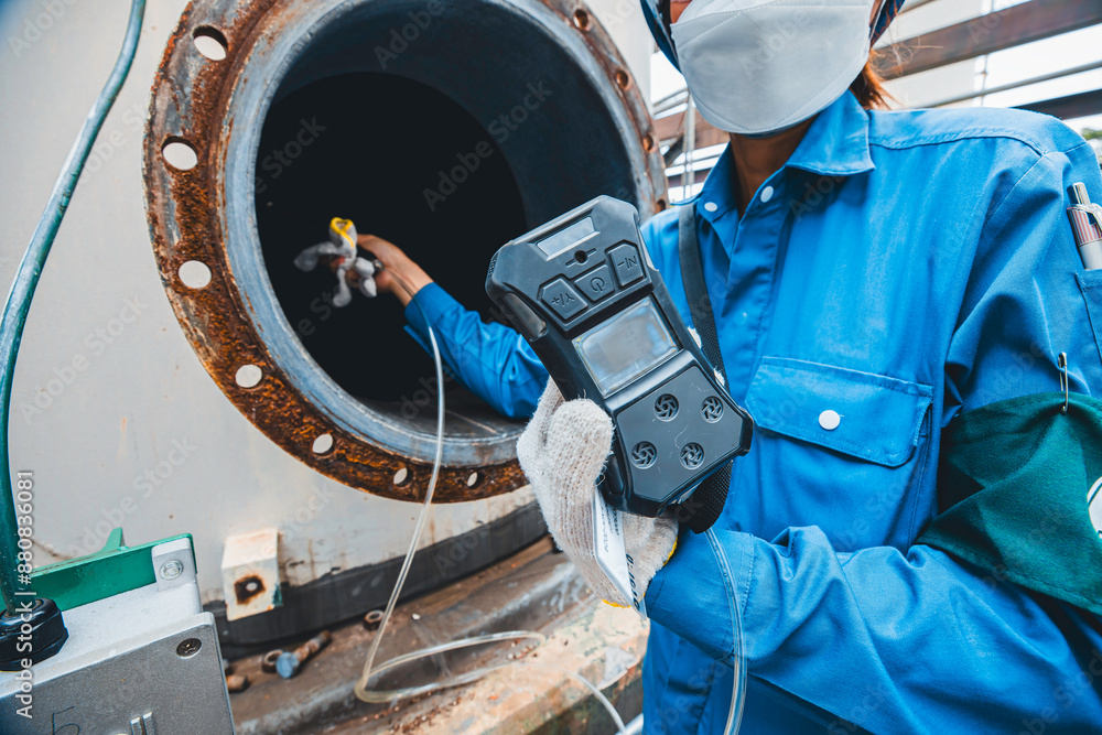 Worker female hand holding gas detector inspection safety gas testing ...