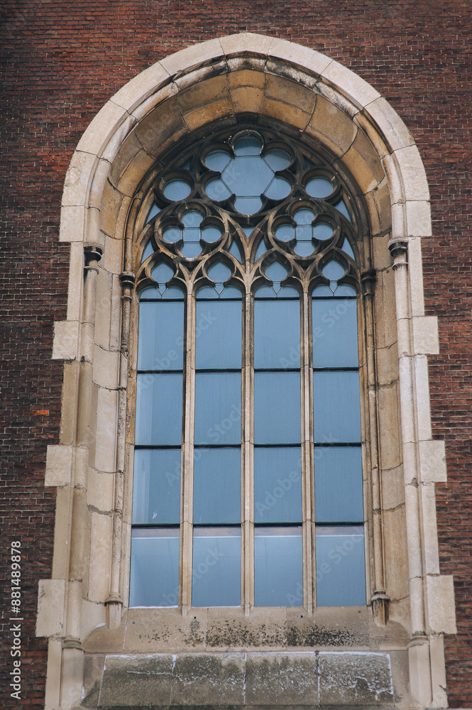 Elongated vintage vertical window on the facade of the building ...