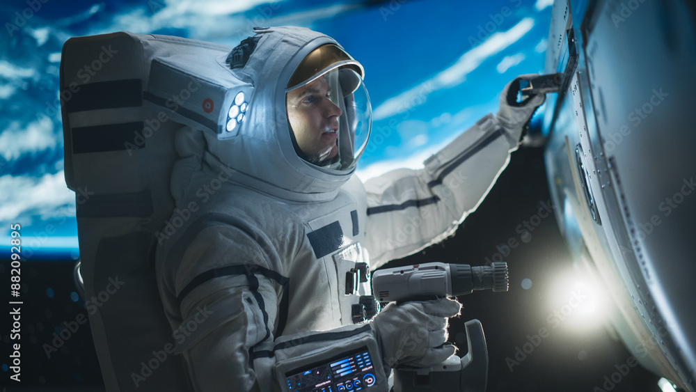 Portrait of Engineer Servicing a Panel on a Communication Satellite ...