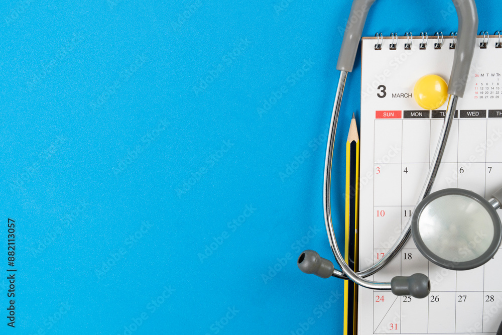 Plan to check health at the hospital with calendar on blue table ...