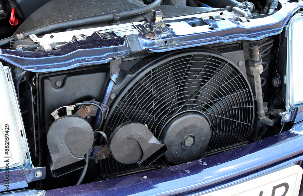 Classic car radiator fan. Car horn under the hood of a car. Cooling ...