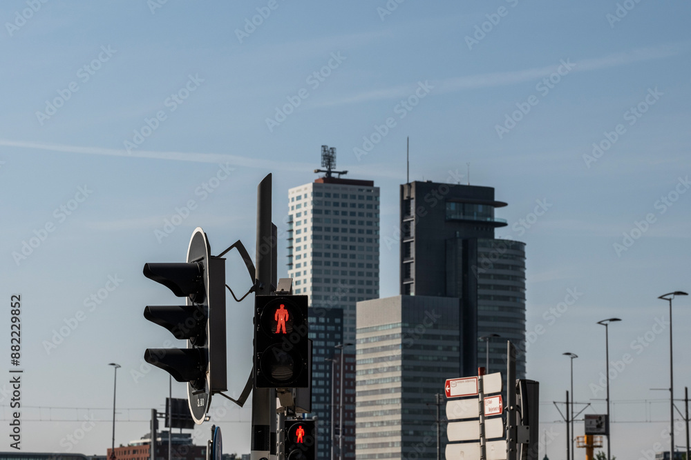 Urban intersections featuring traffic lights with pedestrian signals ...