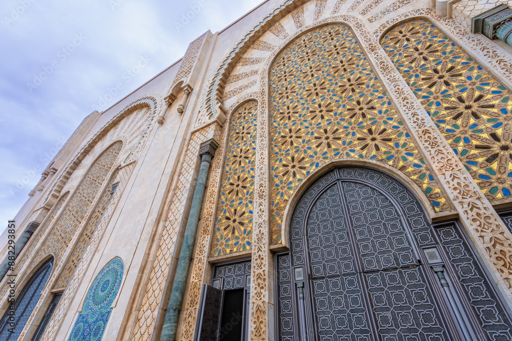 The ornate doors on the facade of the Hassan II Mosque display ...