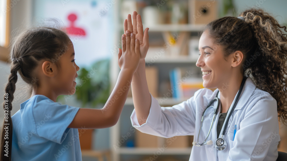 little girl giving high five to female doctor at hospital Stock Photo ...