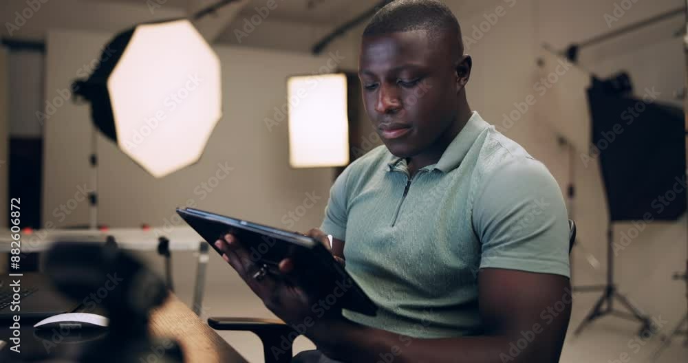 Black man, photographer and production on tablet in studio for editing ...