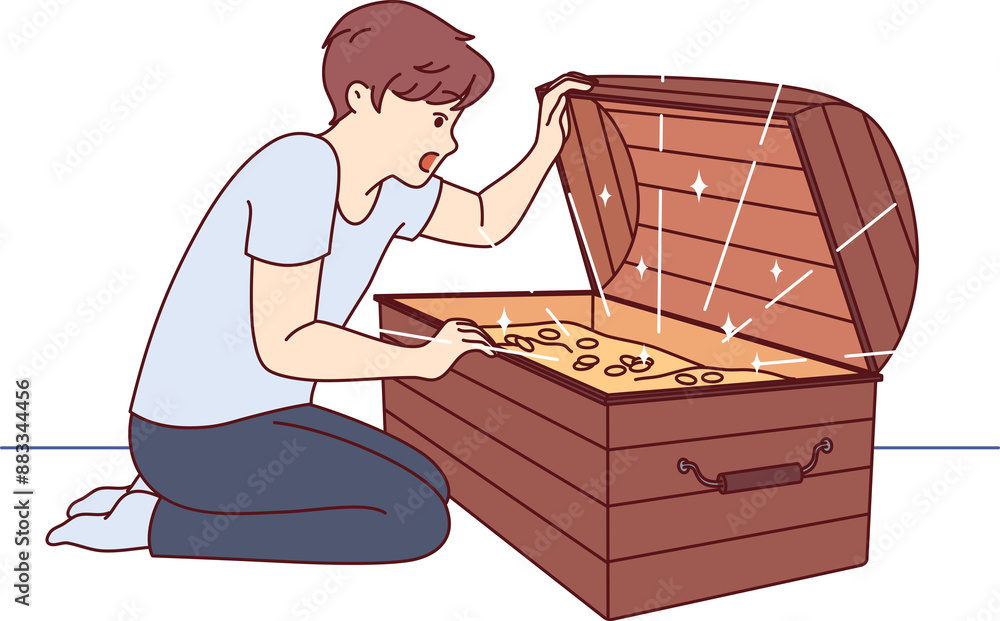 Little boy has found treasure with gold coins and joyfully opens mouth ...