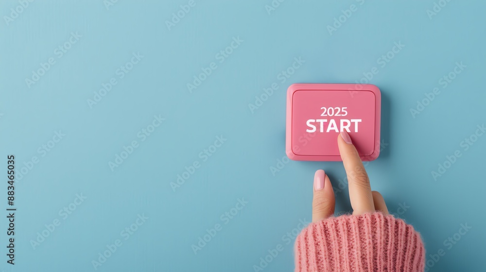 Hand pressing start button for 2025 on pastel blue background. Concept ...