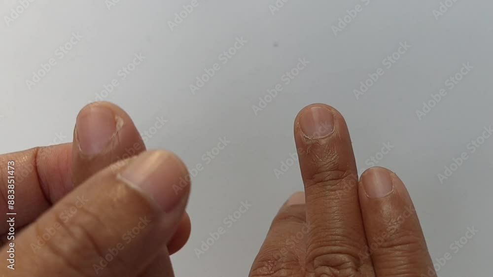 Human fingers taking a closer look at the nails. the tip of the nail ...