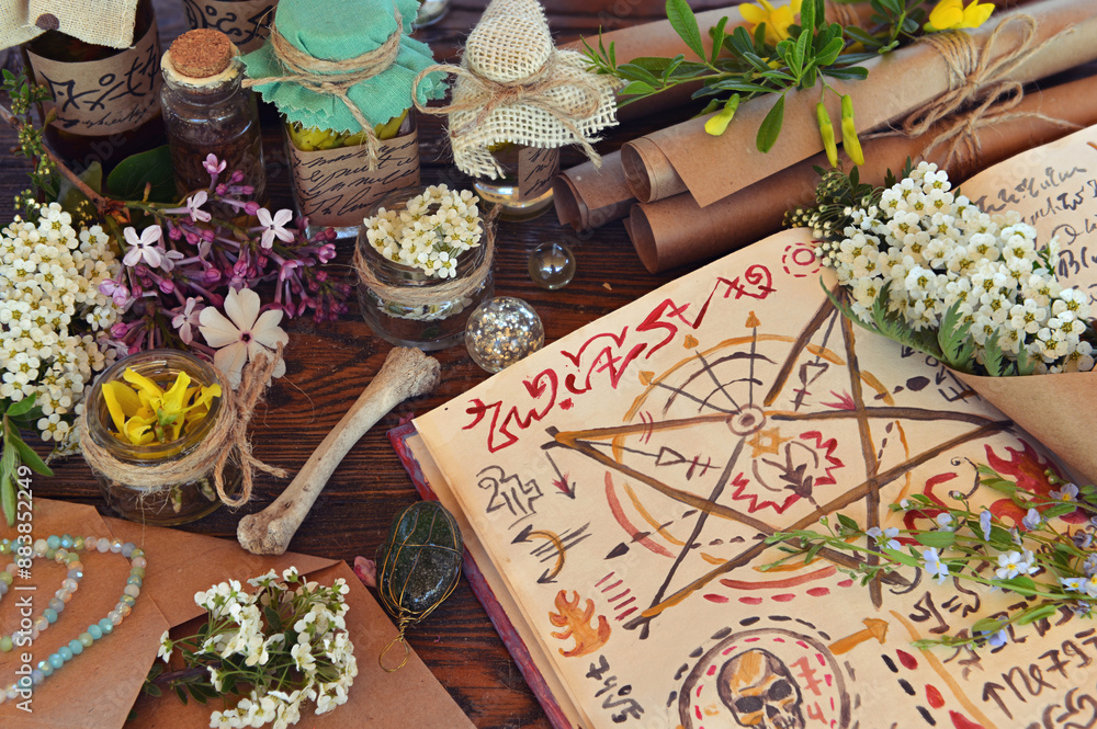 Mystic still life with magic book of spells, paper scrolls and witchy ...