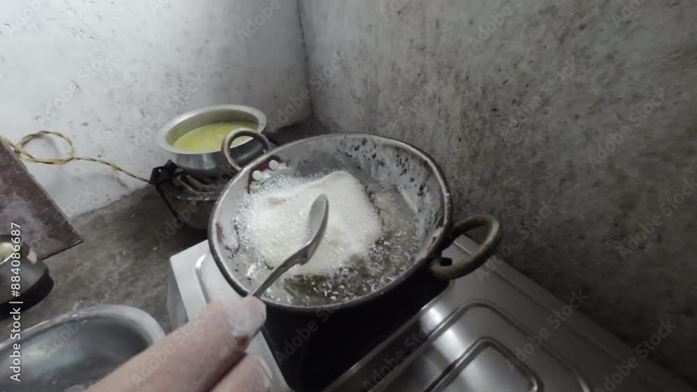 Puri Deep frying in Pan, also poori, is a type of deep-fried bread ...