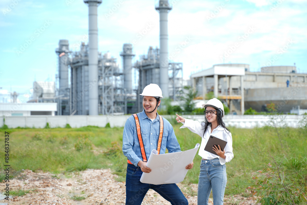 Engineers team Reviewing drawing and Plans on Construction Site at ...