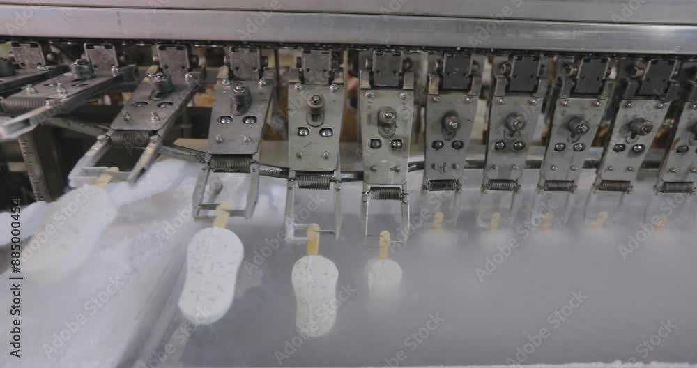 Industrial production of ice cream. Ice cream on a stick. Ice cream ...